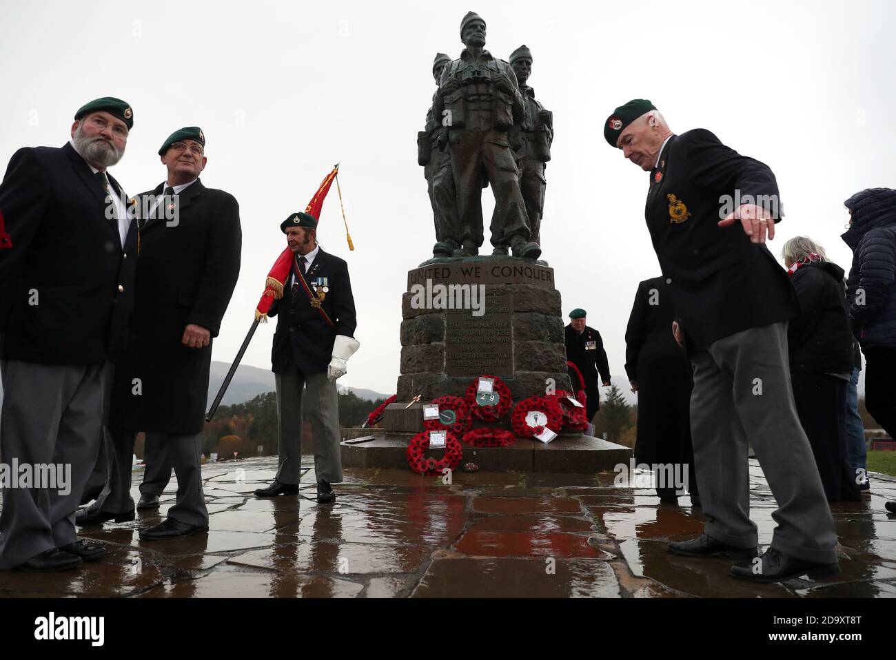 A small number of serving and former Royal Marine Commandos at the Commando Memorial at Spean ...