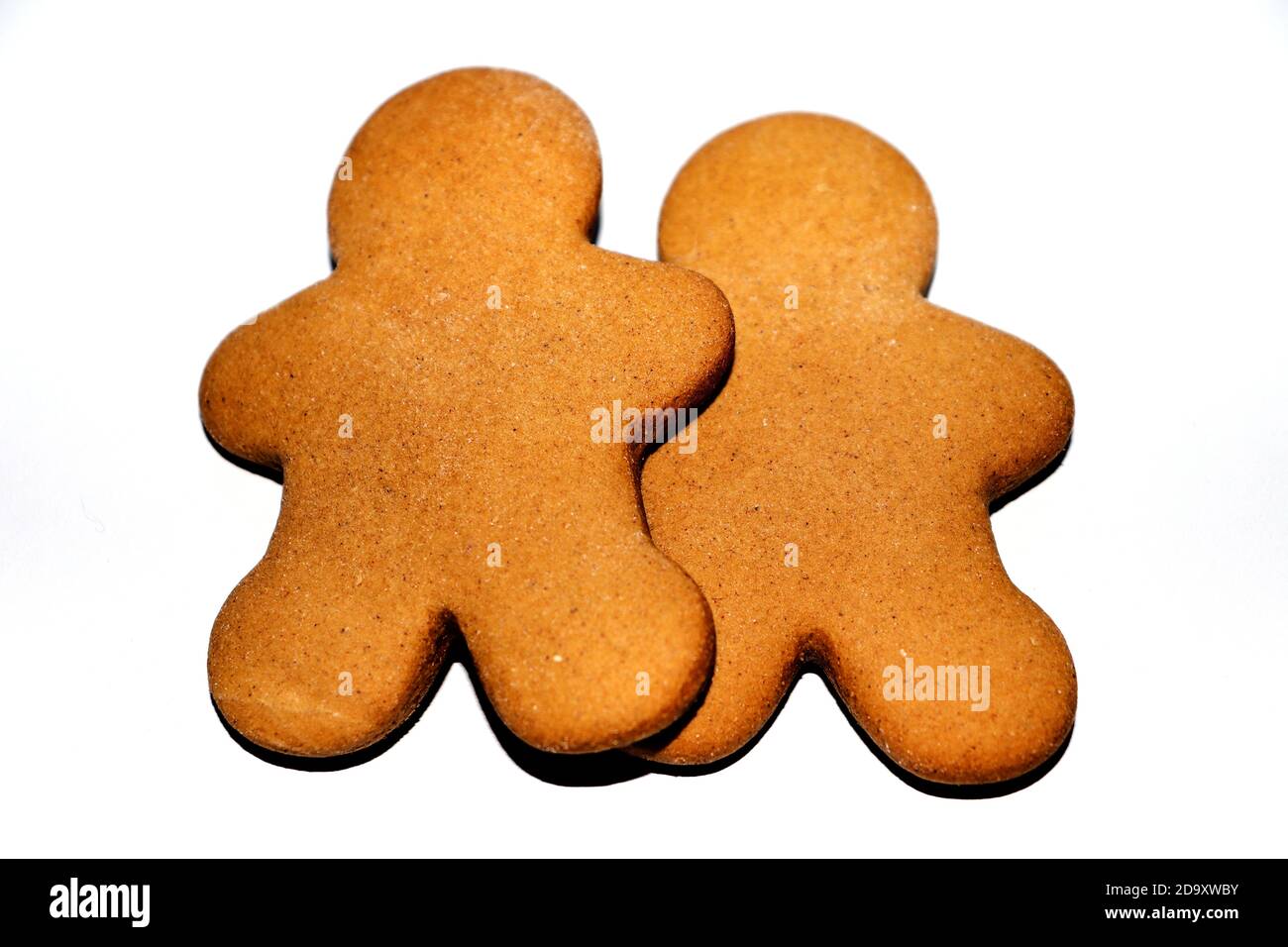 Two gingerbread men on a white background Stock Photo - Alamy