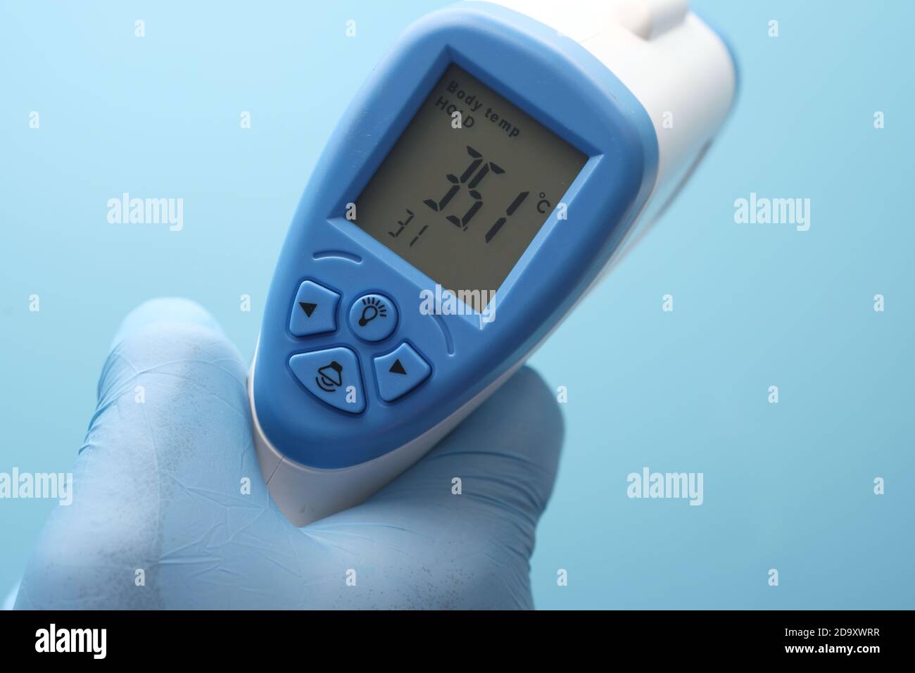 Hand holding infrared thermometer to measuring temperature Stock Photo ...