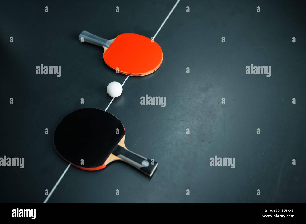 Ping pong ball and rackets on white line, top view Stock Photo - Alamy