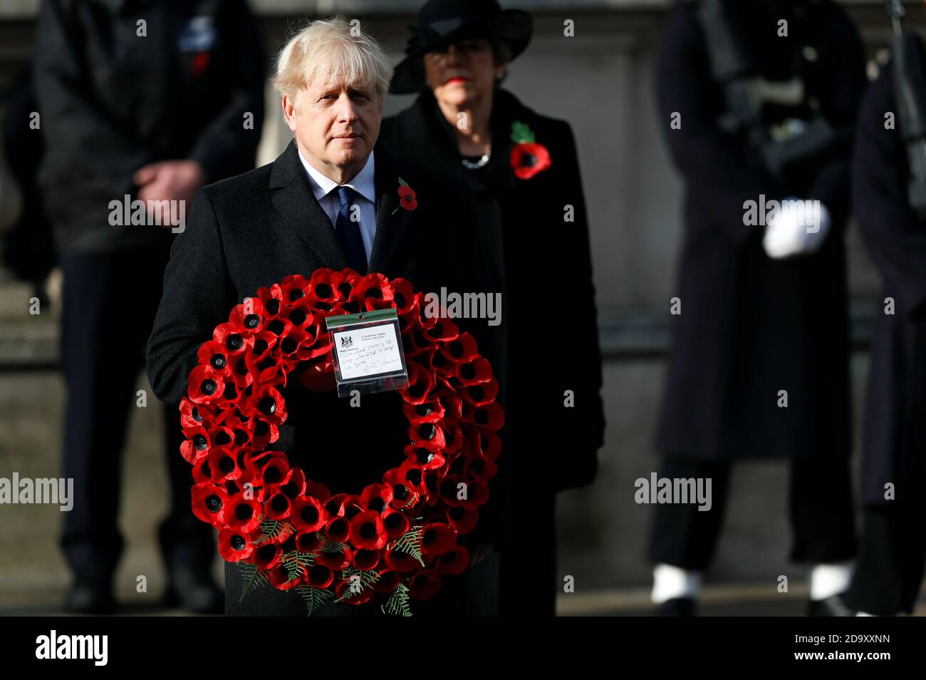 Prime Minister Boris Johnson waits to lay a wreath during the ...