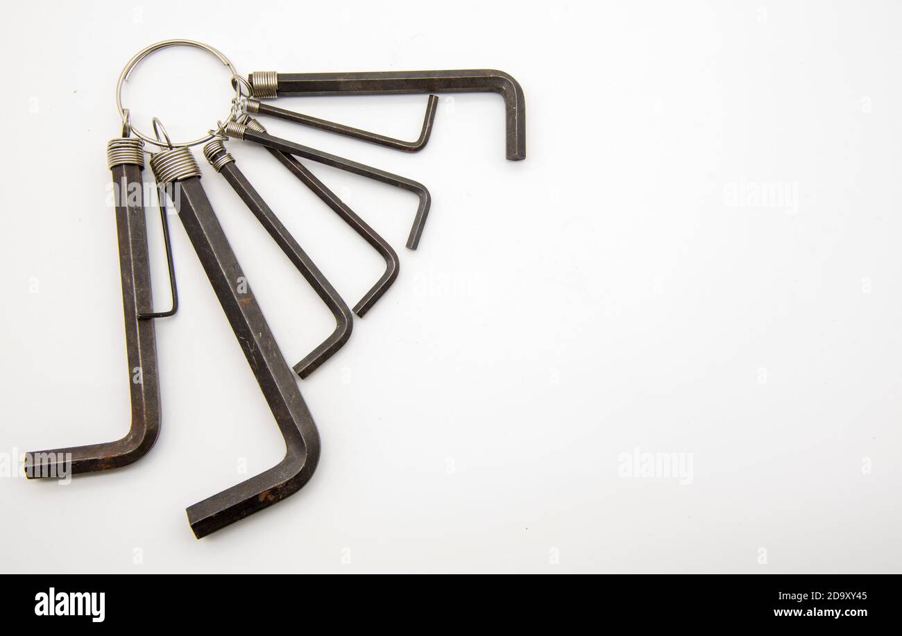 A set of hex keys hanging on ring on a white background Stock Photo - Alamy