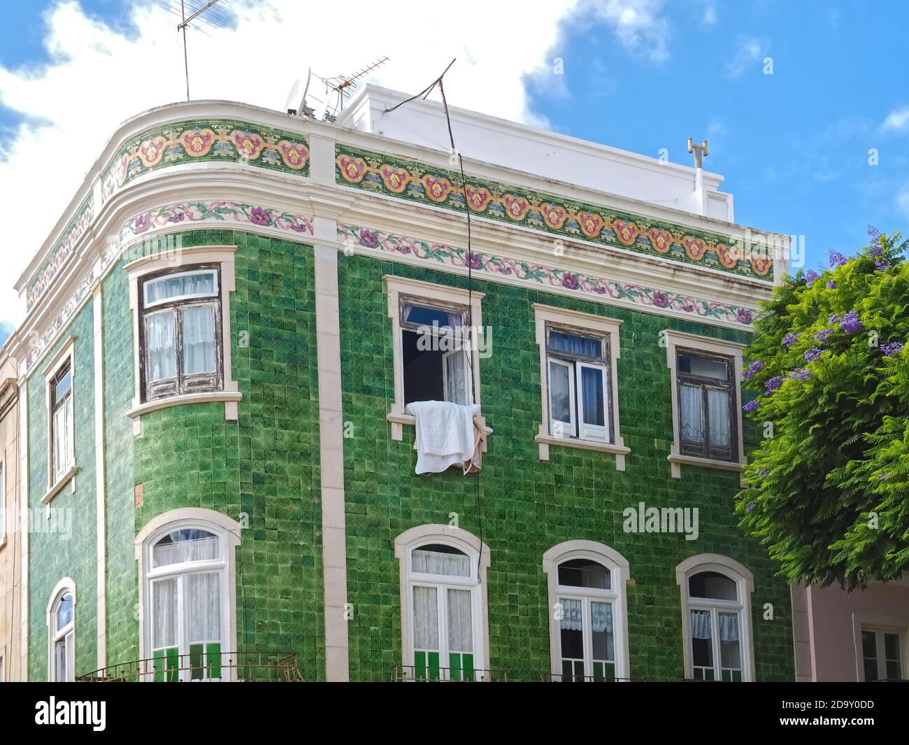 The beauty of Portugal - famous green tiled building in Lagos with ...