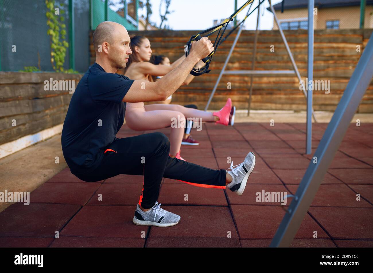 Male instructor and women's group, fit workout Stock Photo - Alamy