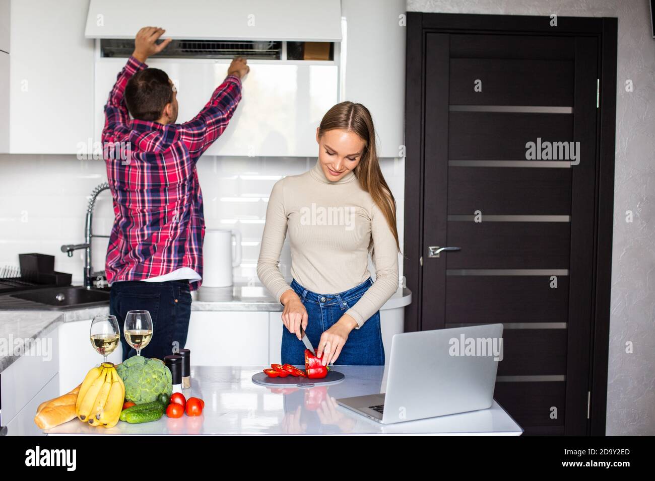 Woman watching men cook hi-res stock photography and images - Alamy