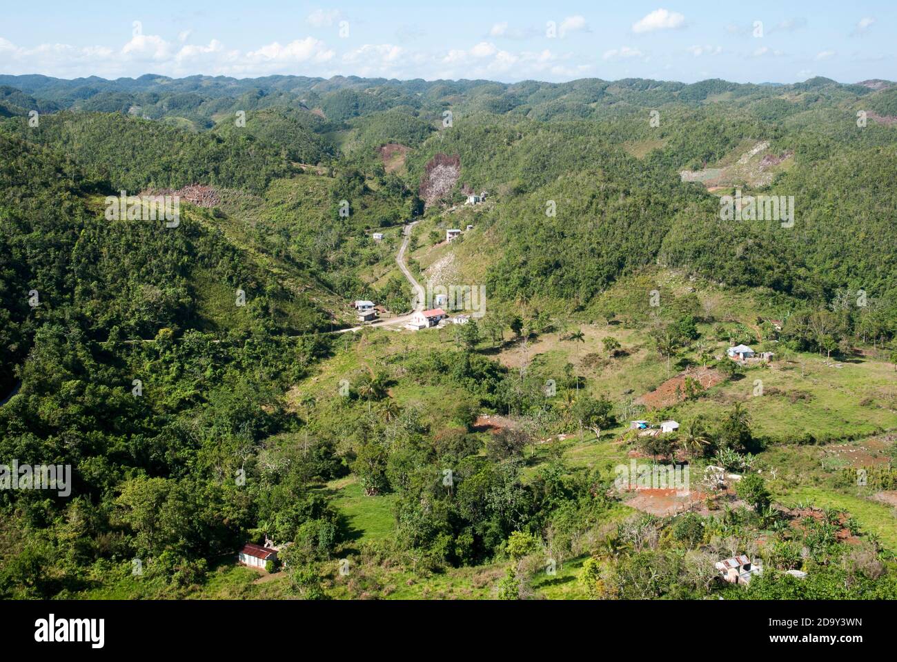 The morning aerial view of a tropical landscape and a small village in ...