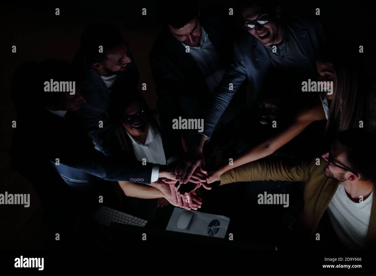 close up.young colleagues joined together their hands Stock Photo - Alamy