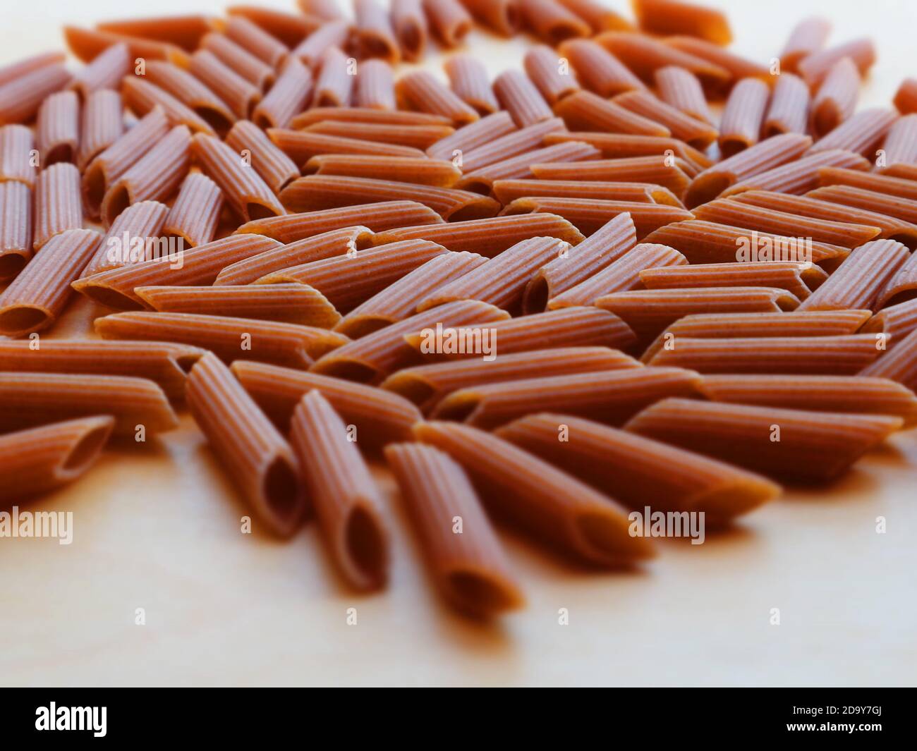 Wholewheat brown penne pasta Stock Photo - Alamy