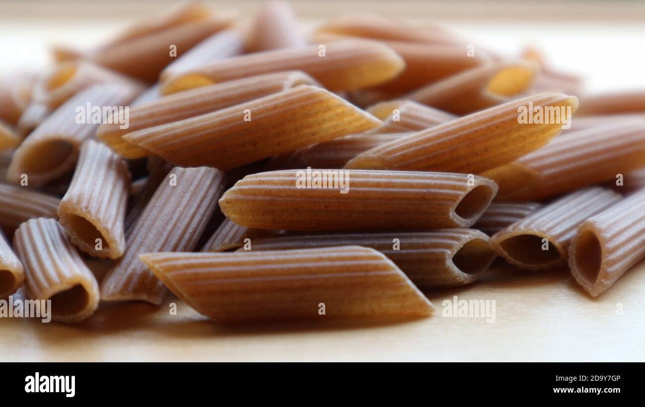 Wholewheat brown penne pasta Stock Photo - Alamy