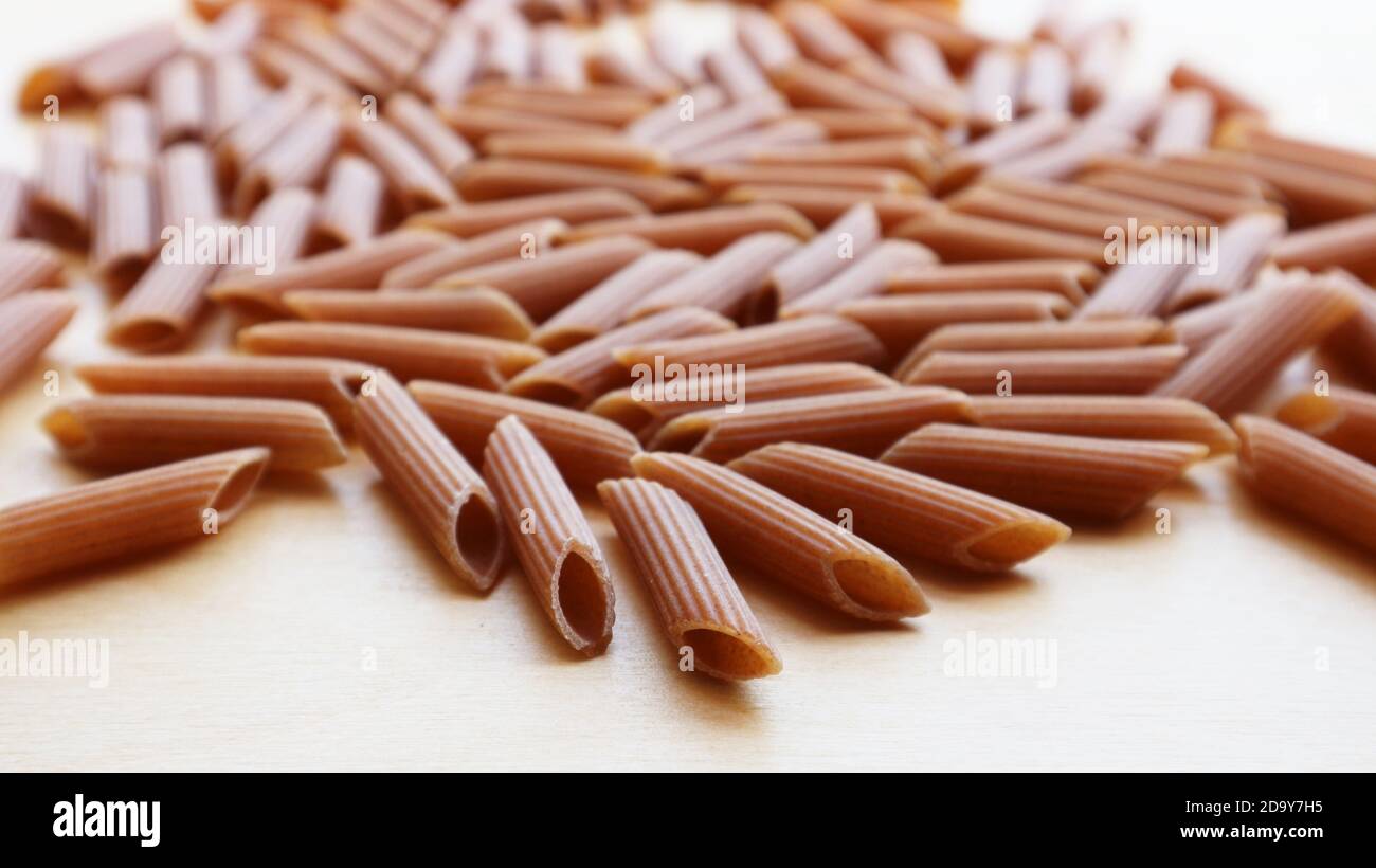 Wholewheat brown penne pasta Stock Photo - Alamy