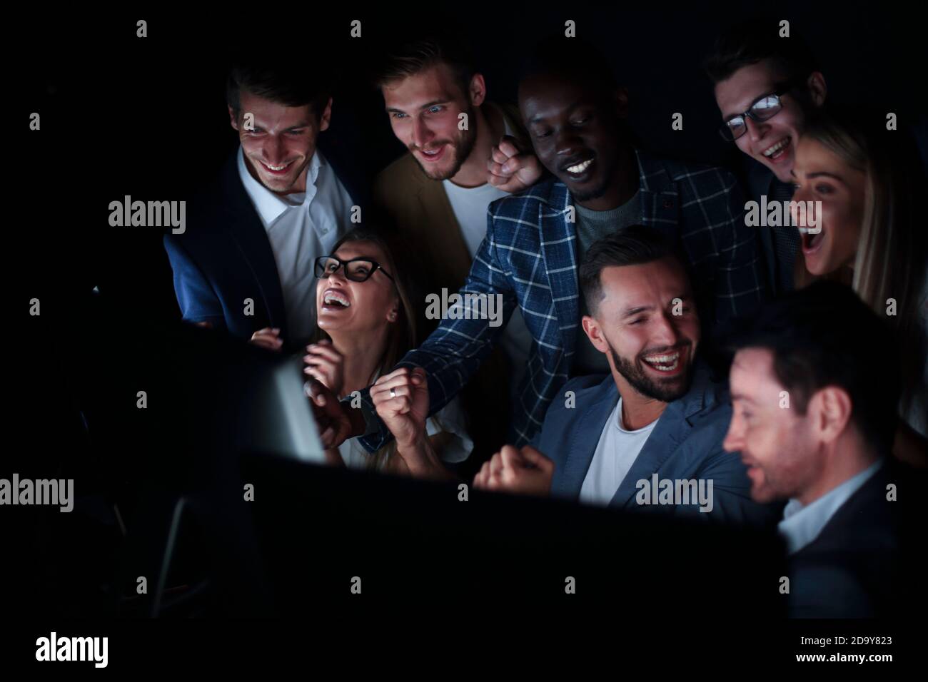 close up.Cheerful business people look at the computer screen Stock ...