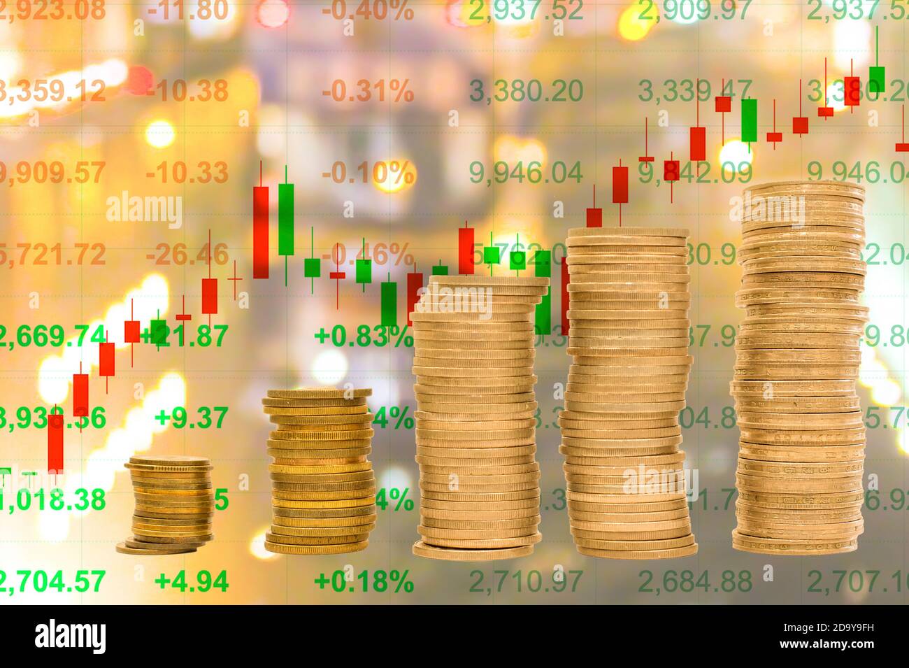 Increasing piles of coins with candle stick graph chart and financial ...