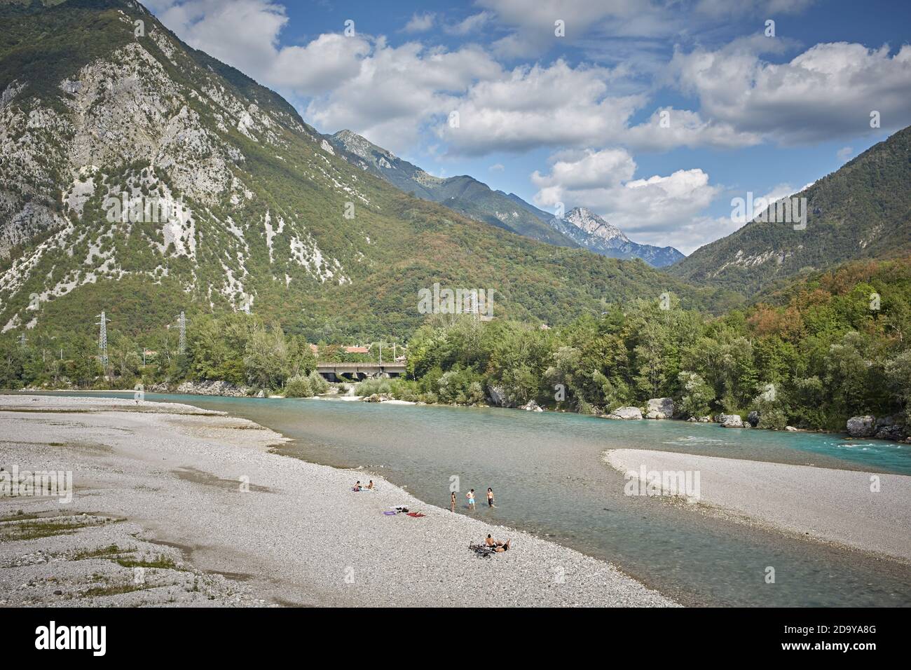 Venzone, Italy, August 2019. People sunbathing and bathing in the ...