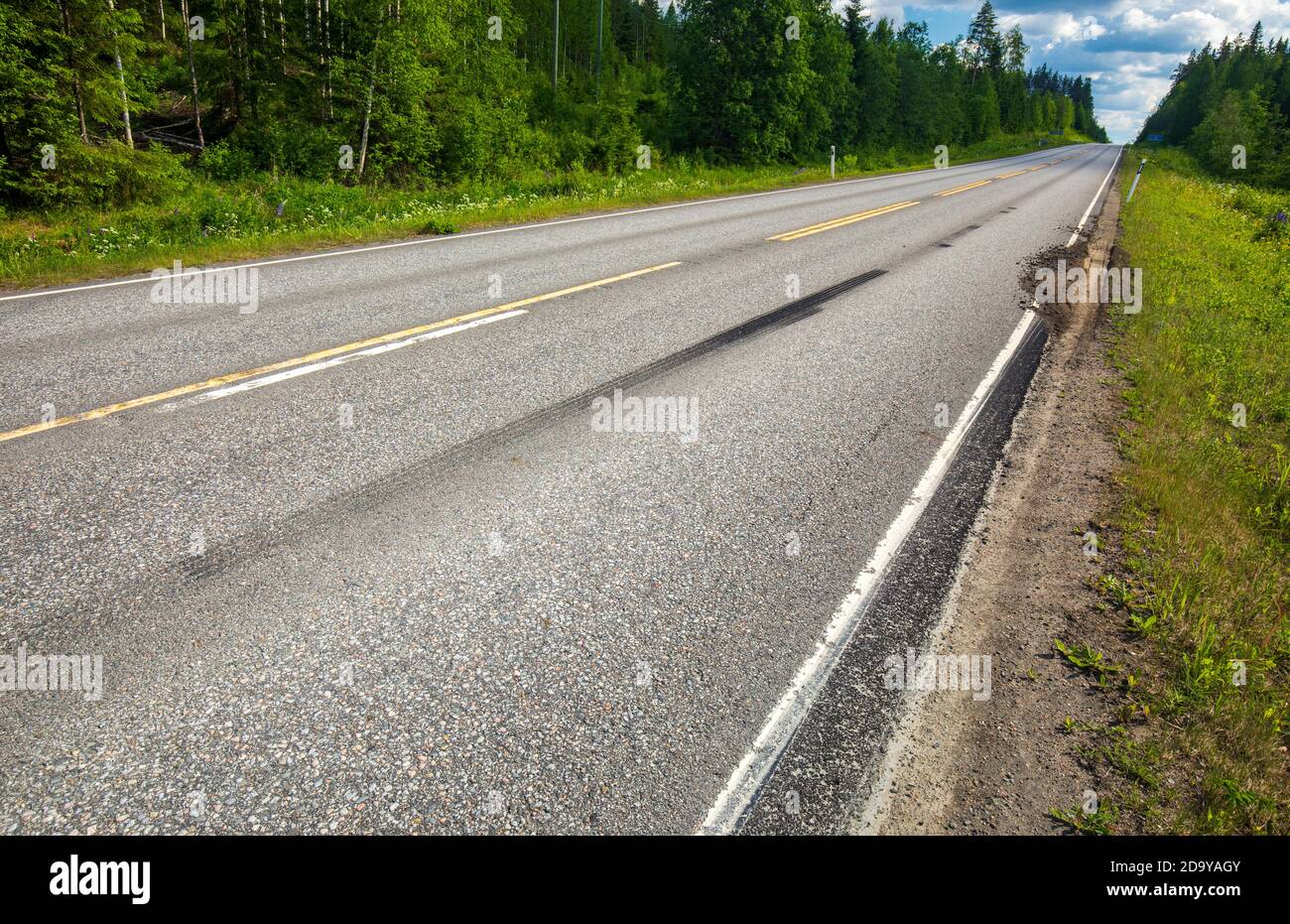 Very long skid marks on tarmac surface at highway after hard braking at ...
