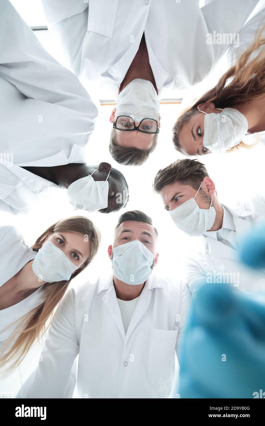 surgeons looking down patient hospital Stock Photo - Alamy