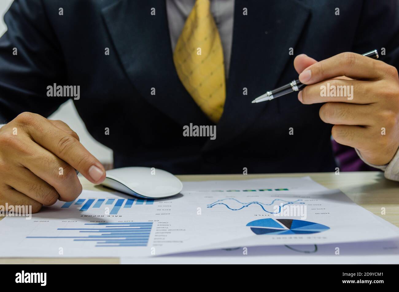Financial business man document graph analyzing and checking income ...