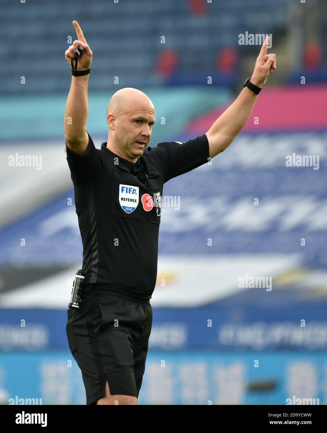 Match referee Anthony Taylor checks with VAR during the Premier League ...