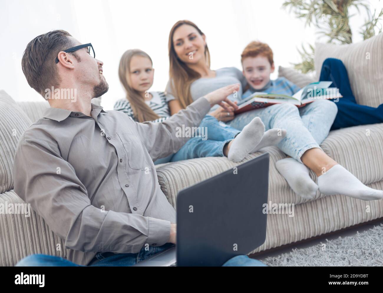 happy family spends their free time in their living room Stock Photo ...