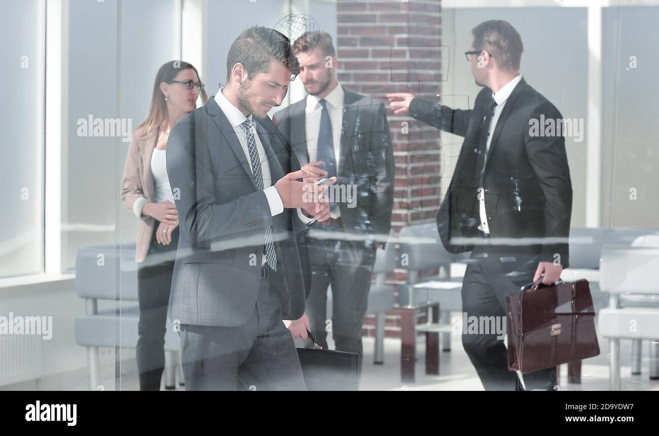 Business people from the back - looking at something Stock Photo - Alamy