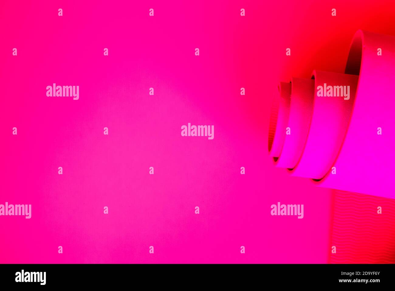 bright pink ultramarine yoga mat on a coral background Stock Photo - Alamy