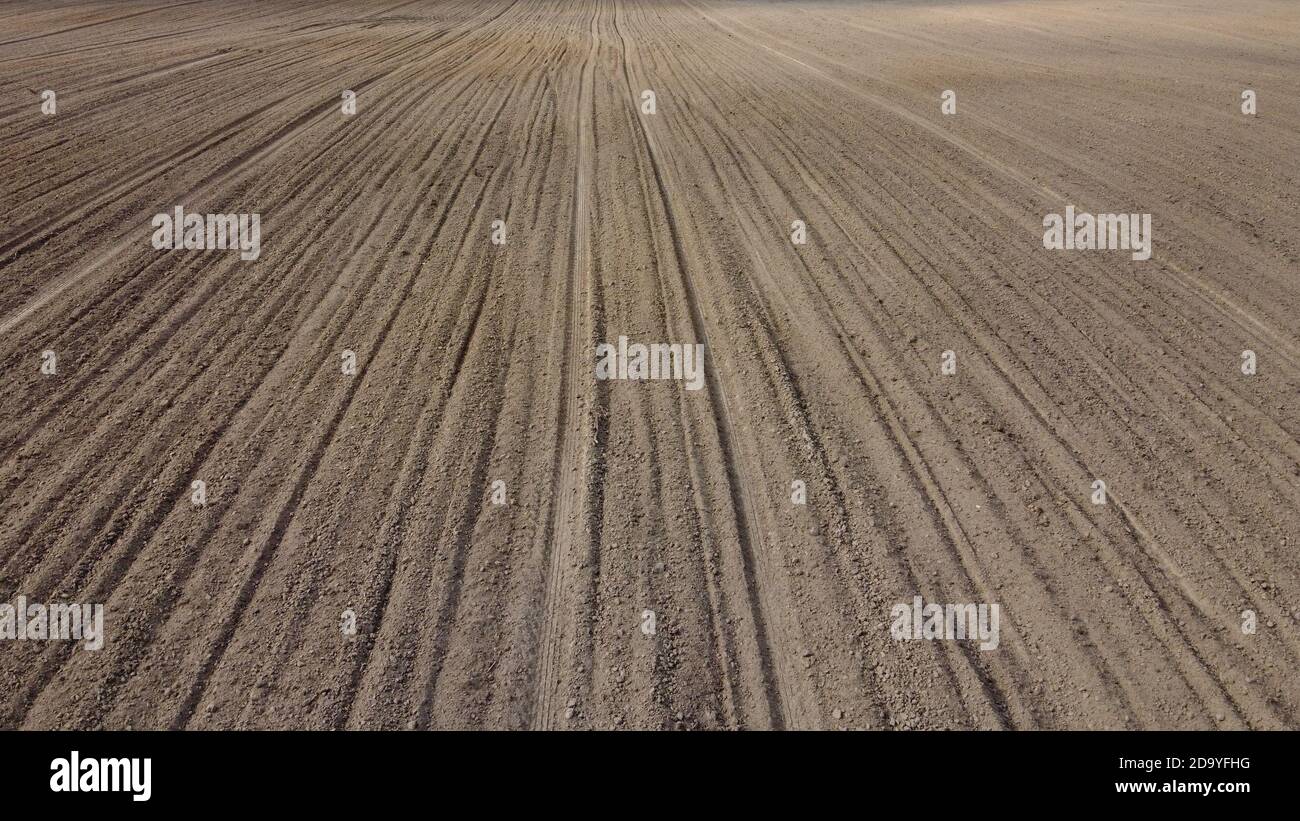 Plowed agricultural field, aerial view. Agricultural land. Background ...