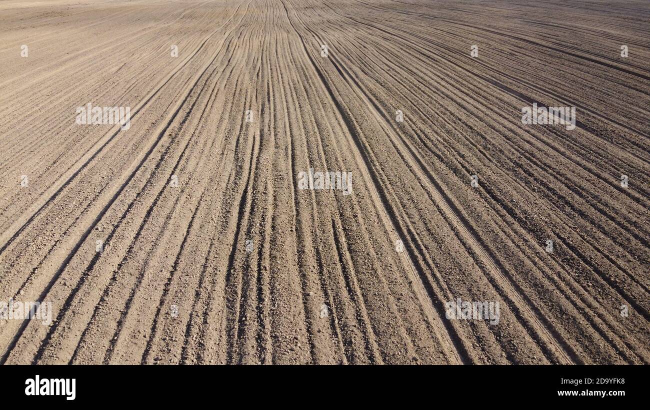 Plowed agricultural field, aerial view. Agricultural land. Background ...