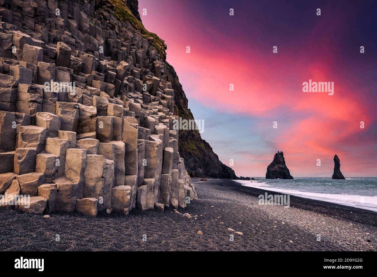 Incredible view on Black beach and Troll toes cliffs in sunset time ...