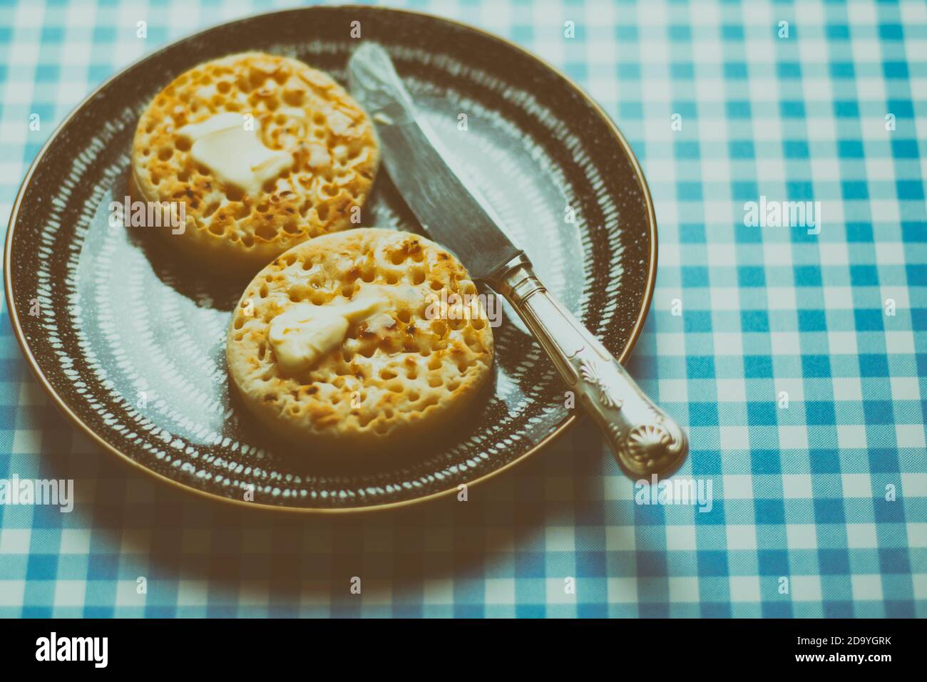 Old Formica table with crumpets on a plate Stock Photo - Alamy
