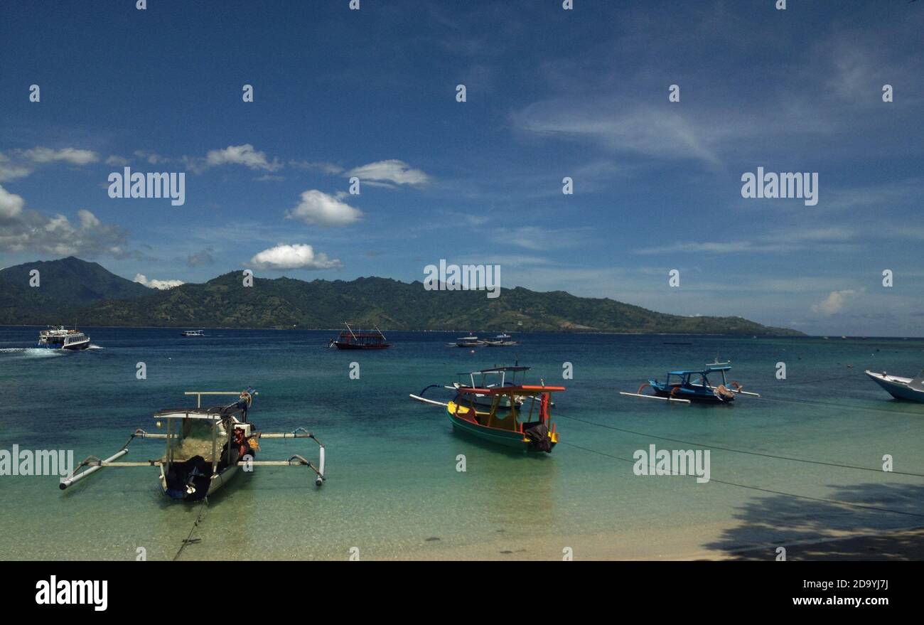 Boats tied up in the shallow seas of the Gili islands, Indonesia Stock ...