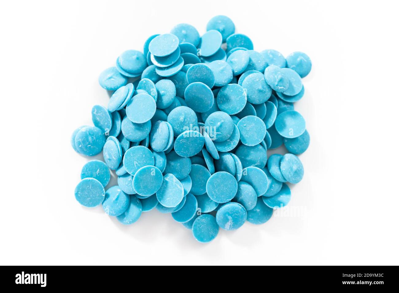 Blue round chocolate chips for melting chocolate shapes Stock Photo - Alamy