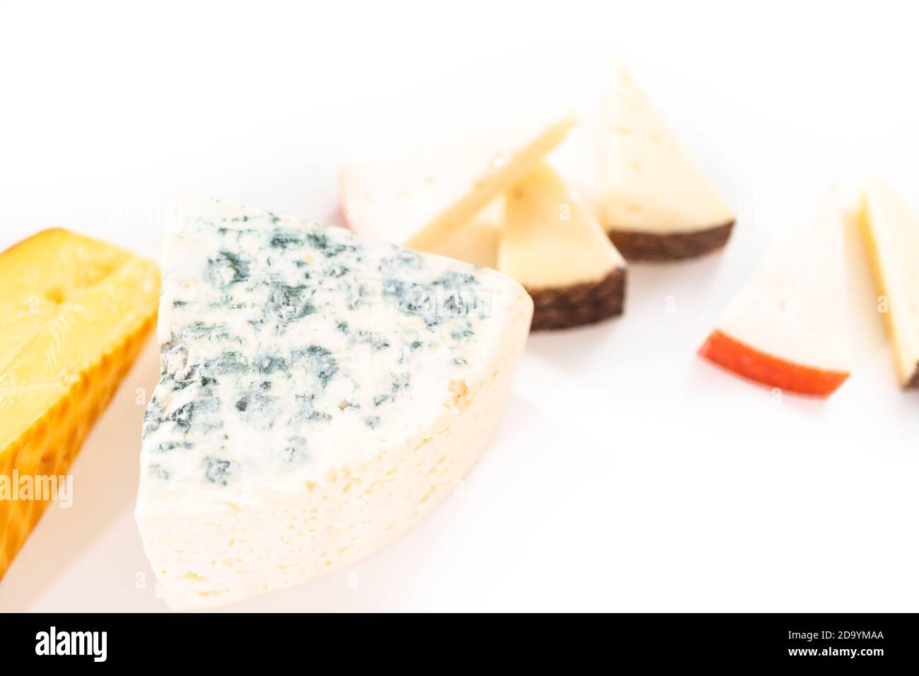 Variety of large wedges gourmet cheese on a white background Stock ...