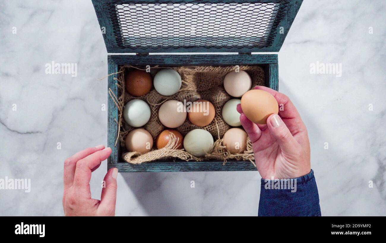 Flat lay. Colorful farm fresh eggs in vintage egg crate Stock Photo - Alamy
