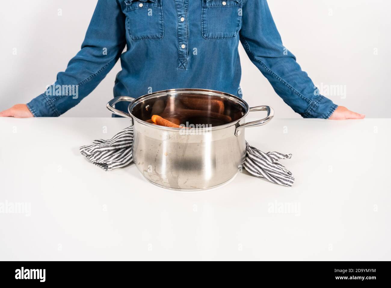 Boiling vegetables in a big cooking pot to make a vinaigrette salad ...