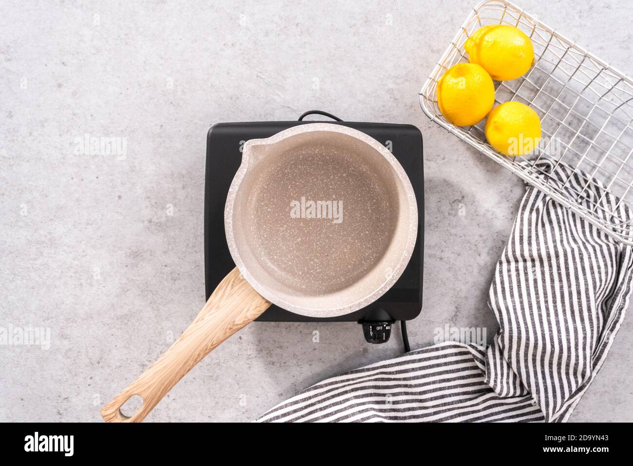 Flat lay. Cooking cake syrup for cake in a saucepan Stock Photo - Alamy