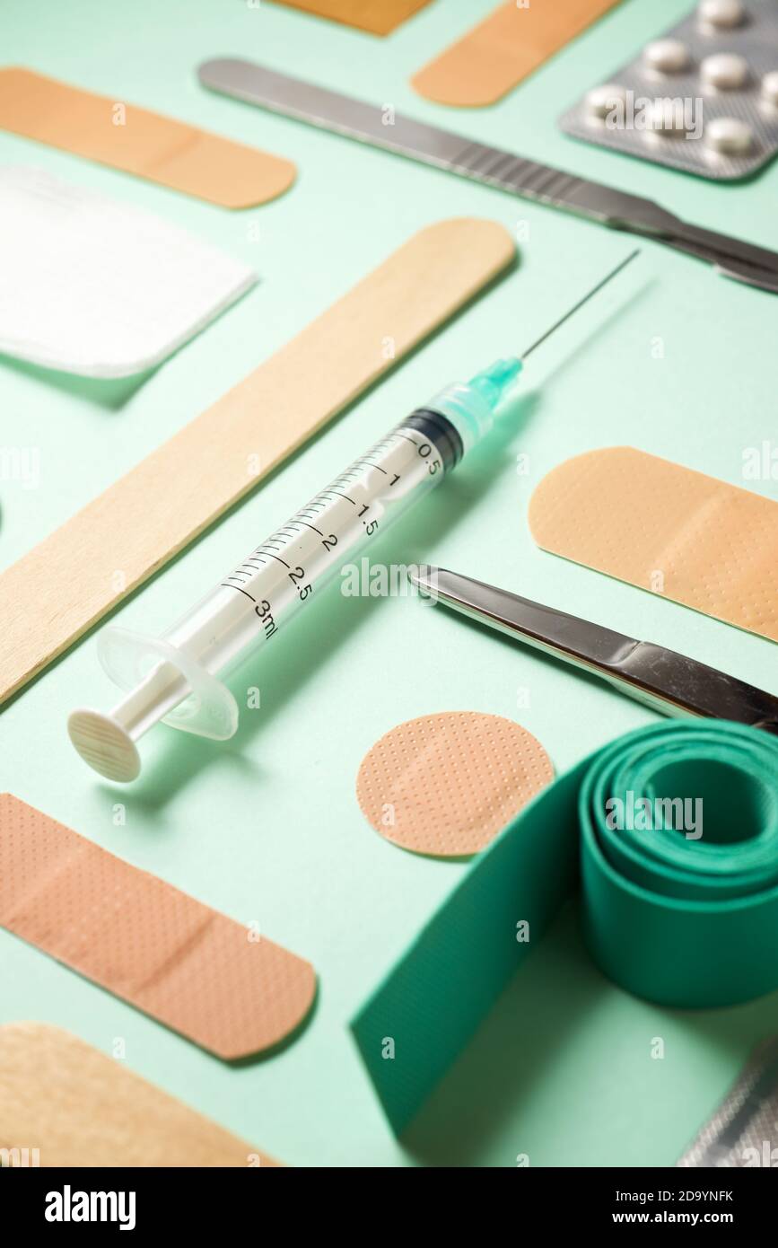 First aid kit on a green table Stock Photo - Alamy