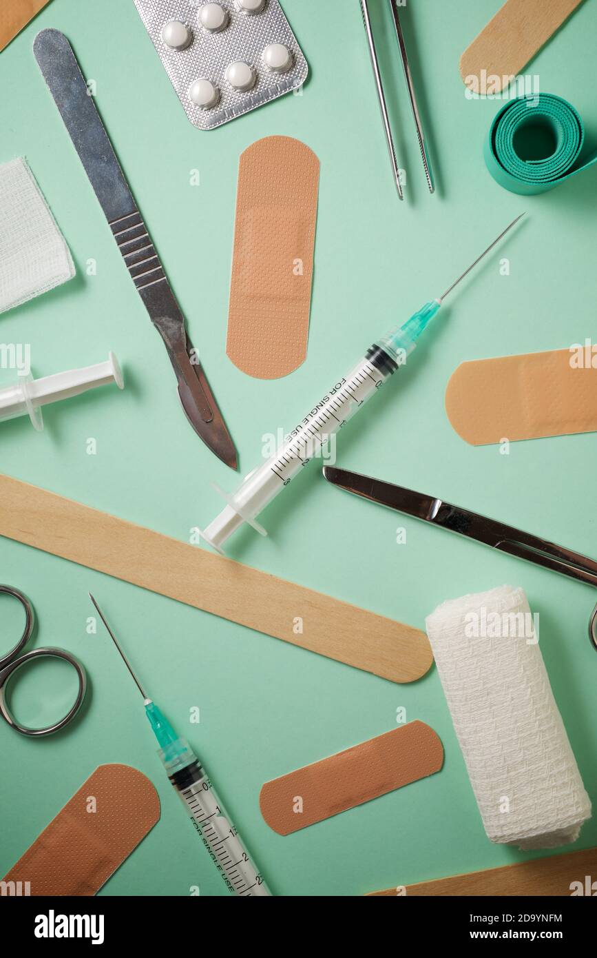 First aid kit on a green table Stock Photo - Alamy