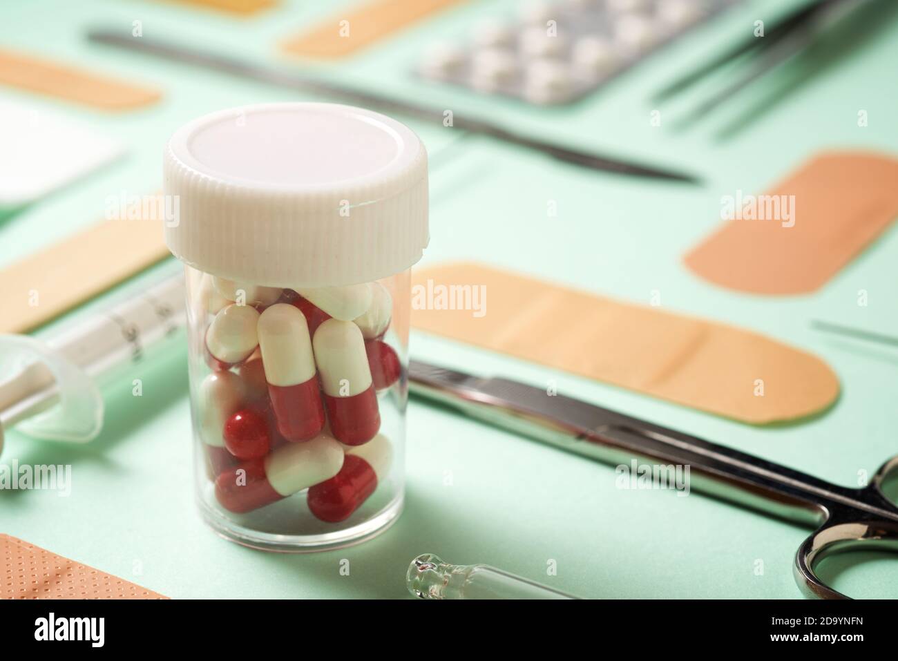 First aid kit on a green table Stock Photo - Alamy