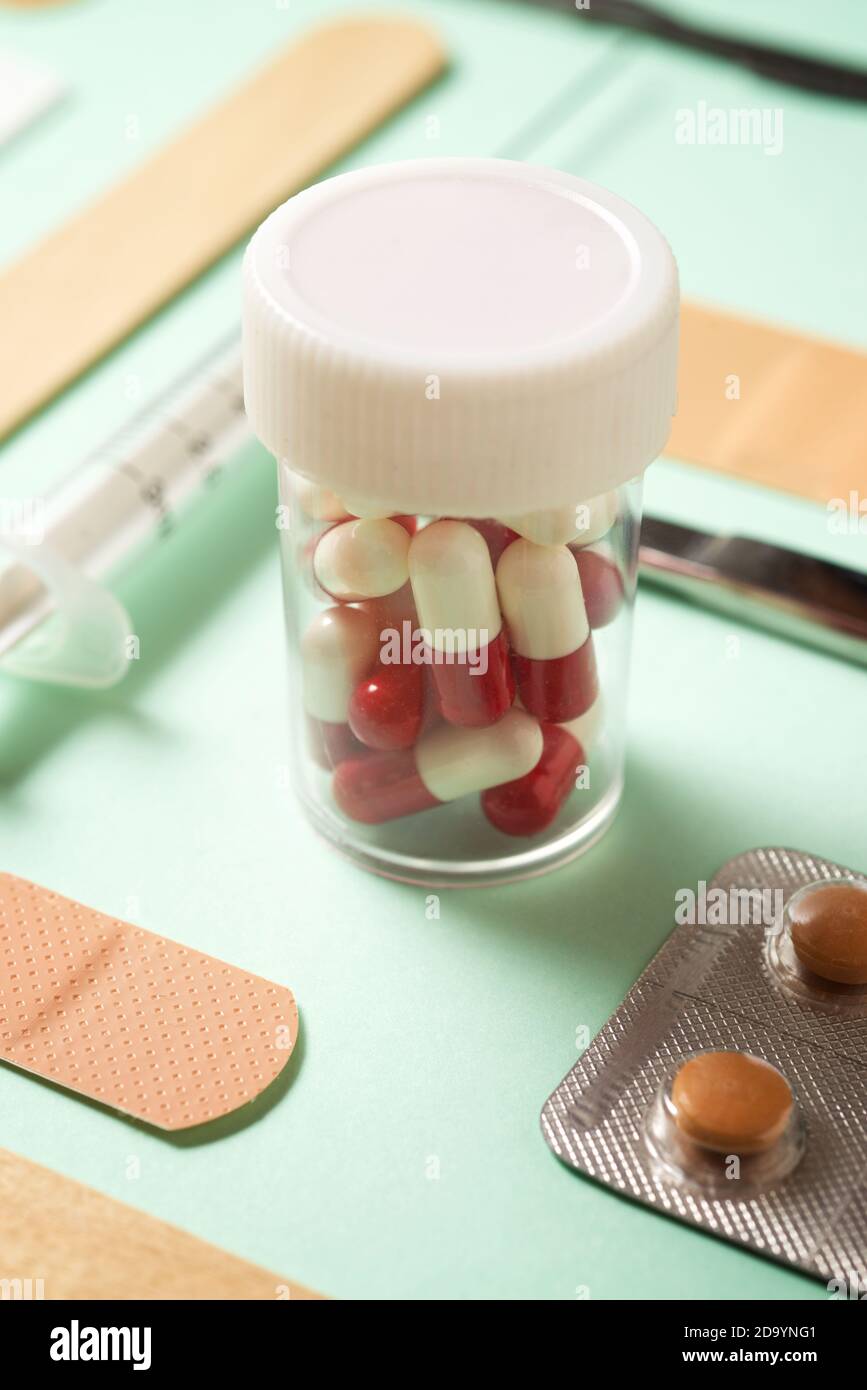 First aid kit on a green table Stock Photo - Alamy