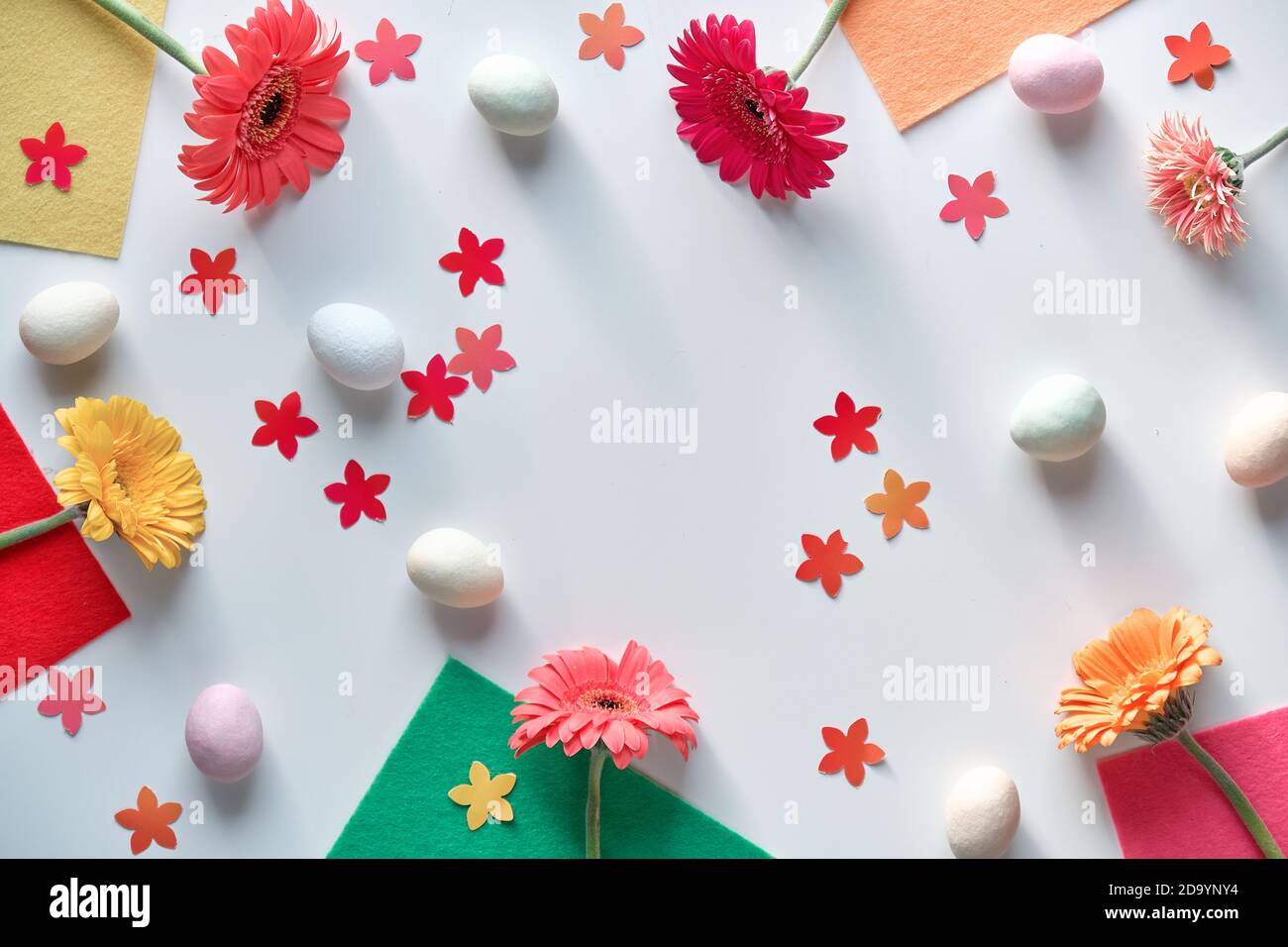 Easter background with marzipan Easter eggs, gerbera daisy flowers ...
