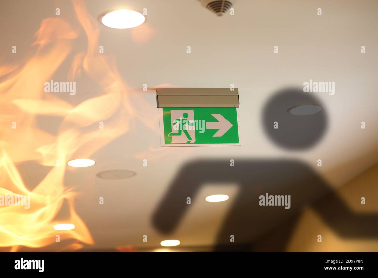 emergency exit sign and fire in the building Stock Photo - Alamy