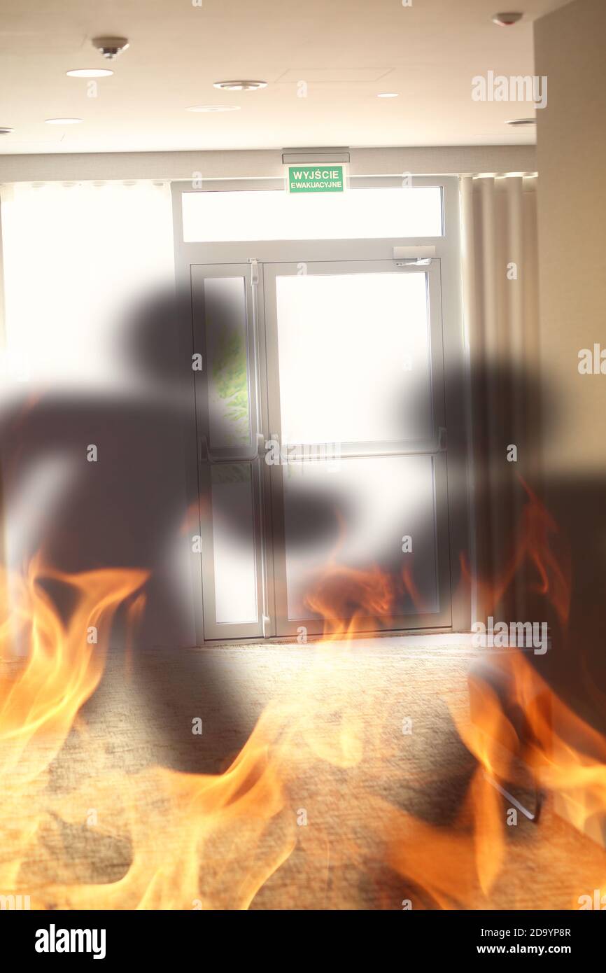emergency exit sign and fire in the building Stock Photo - Alamy