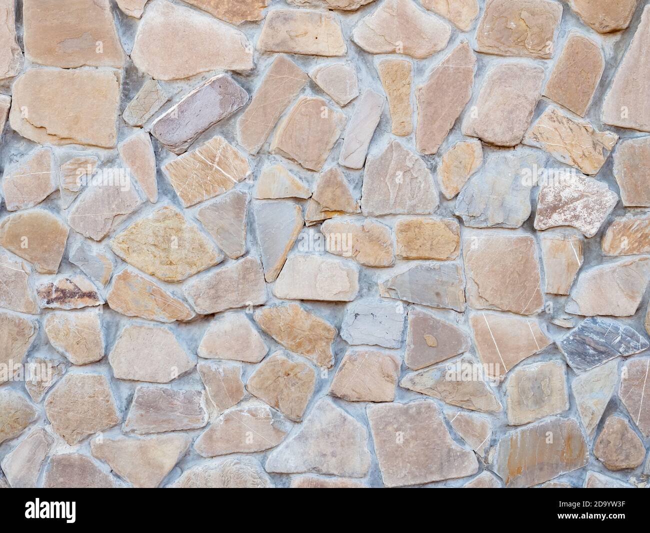 Wall with uneven masonry. Background texture. Full screen Stock Photo ...