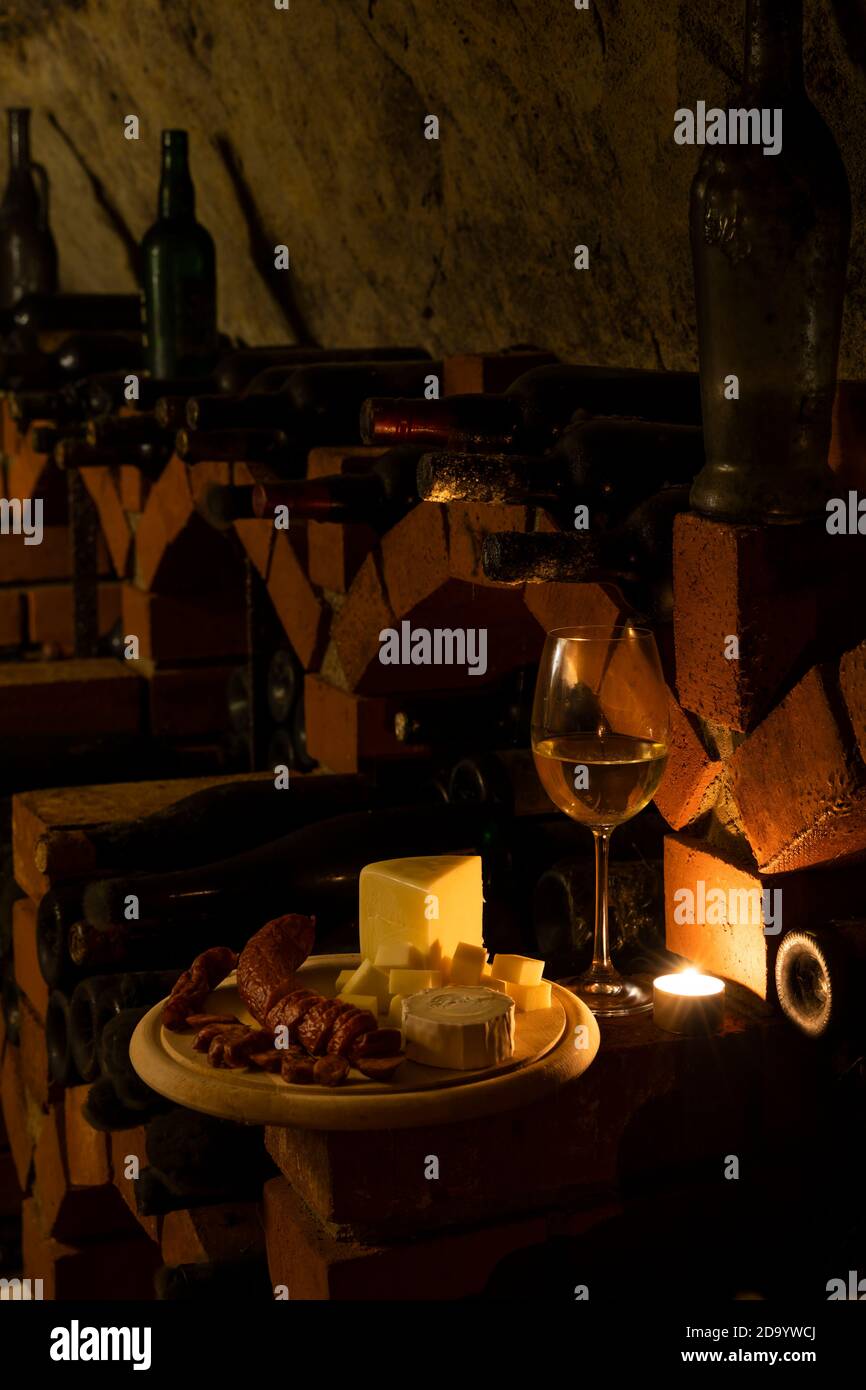 Traditional food in a wine cellar with archival wine, Znojmo region ...