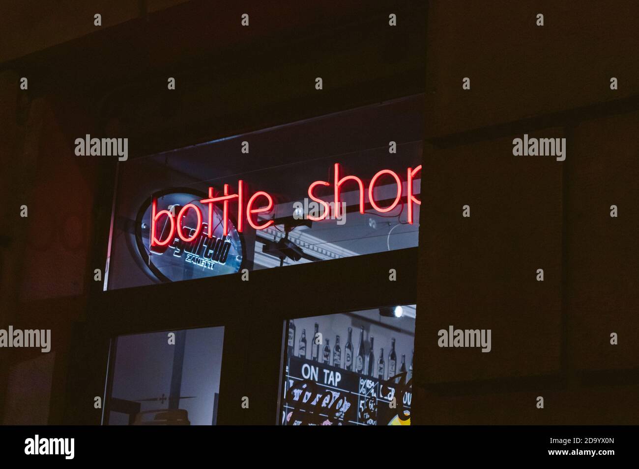 neon sign bottle shop bar wine beer sale showcase Stock Photo - Alamy
