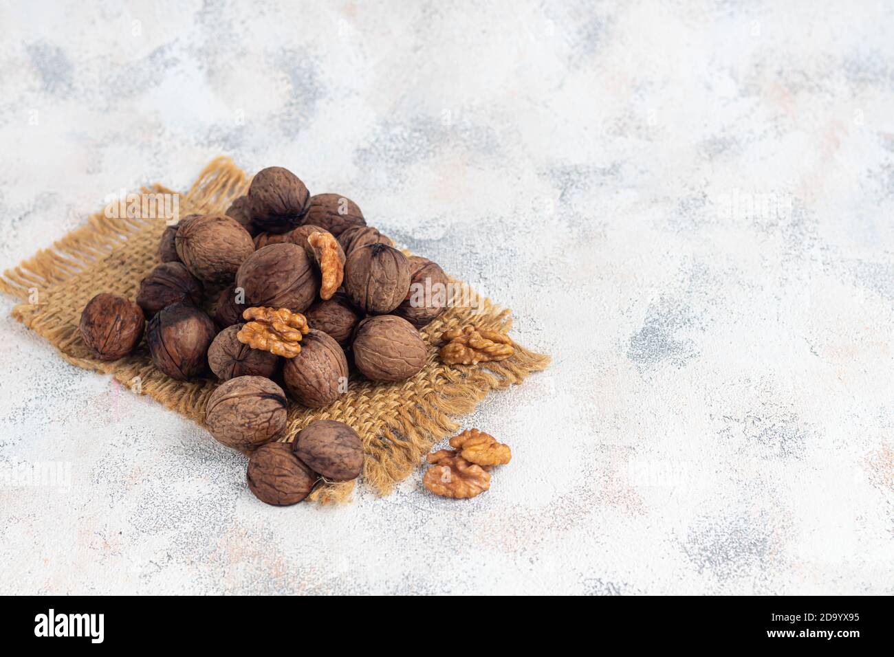 Walnuts. Contains beneficial vitamins and minerals. On a gray ...