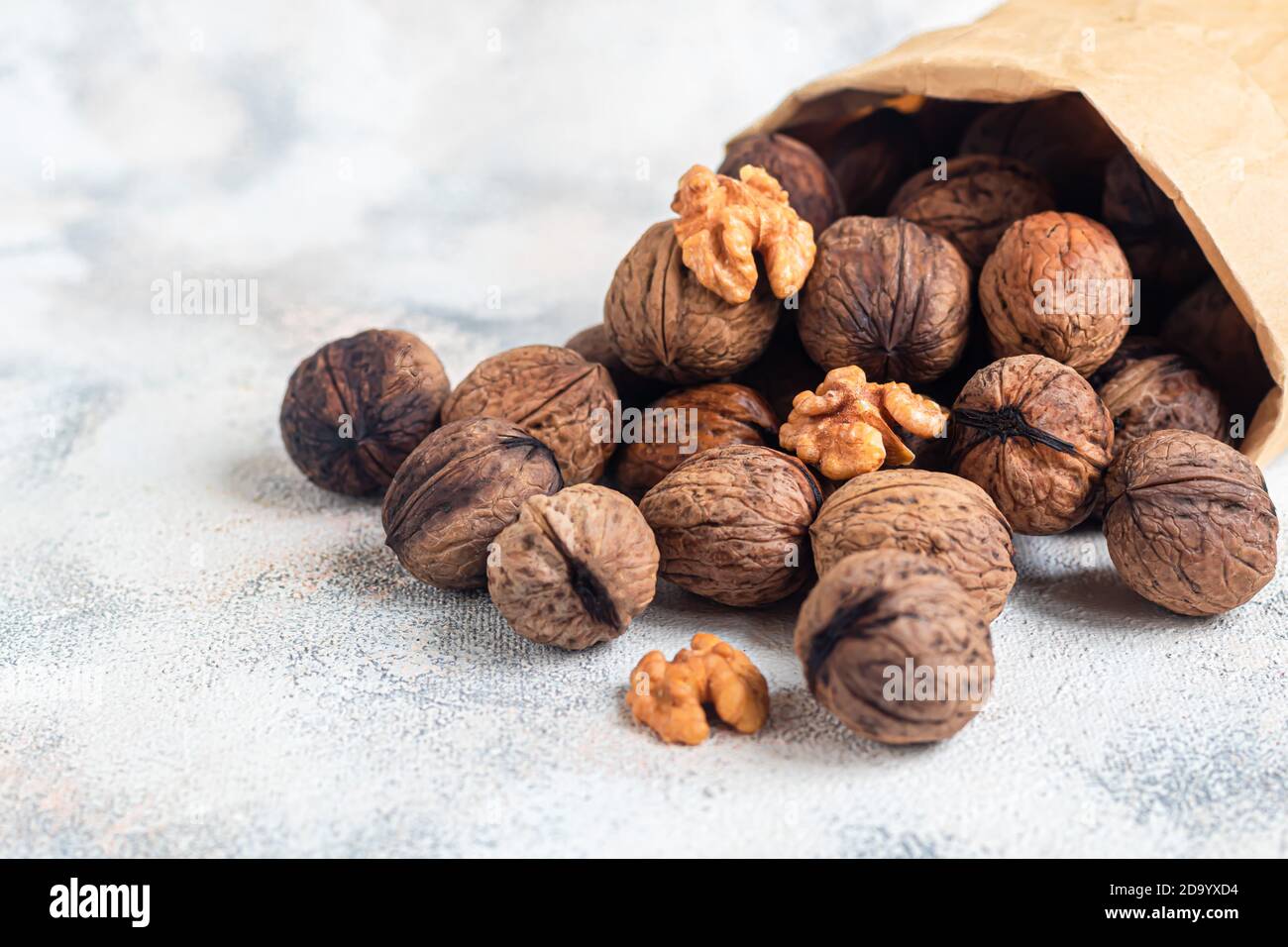 Walnuts. Contains beneficial vitamins and minerals. On a gray ...