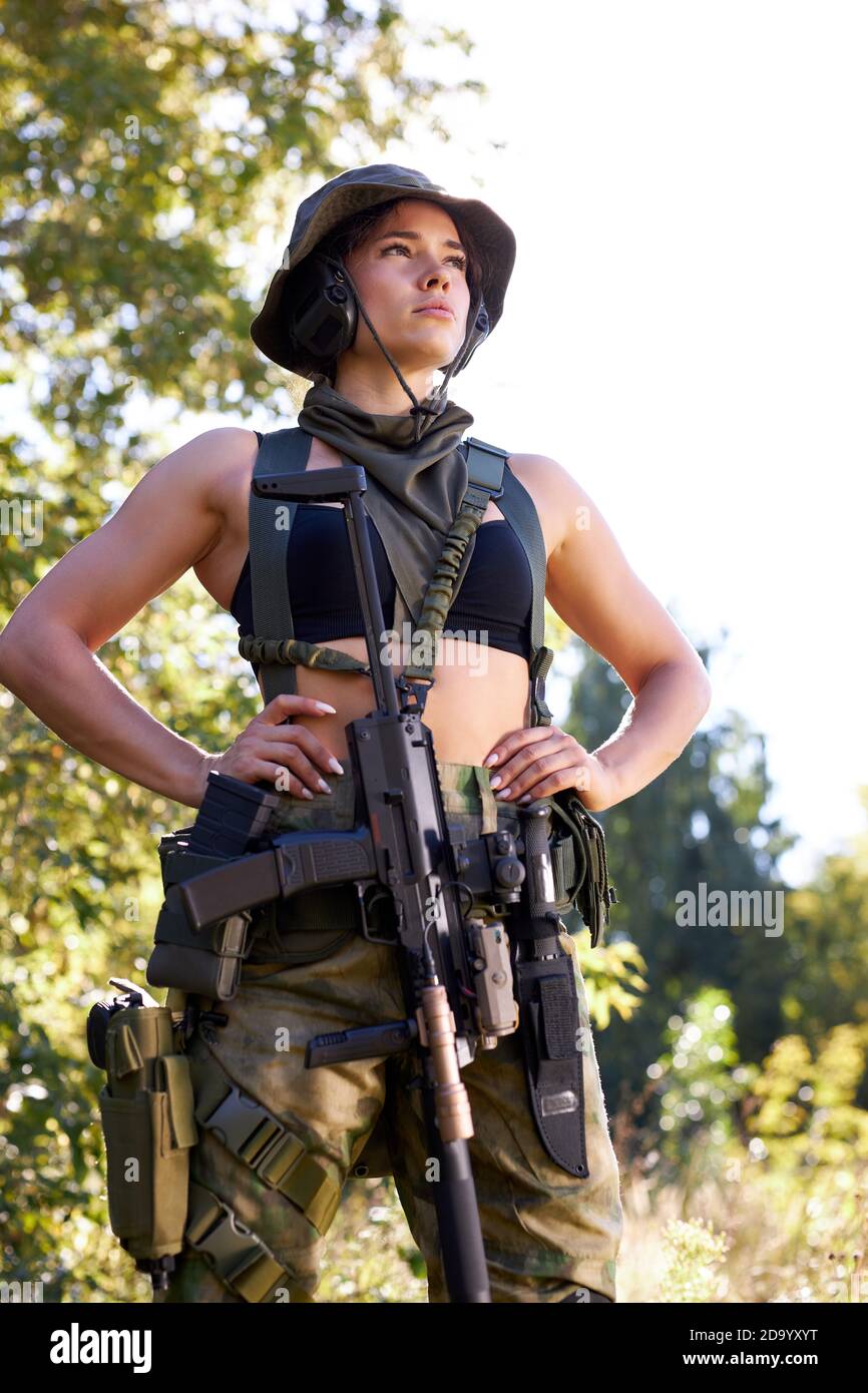 powerful sportive woman soldier ready for battle wearing protective ...