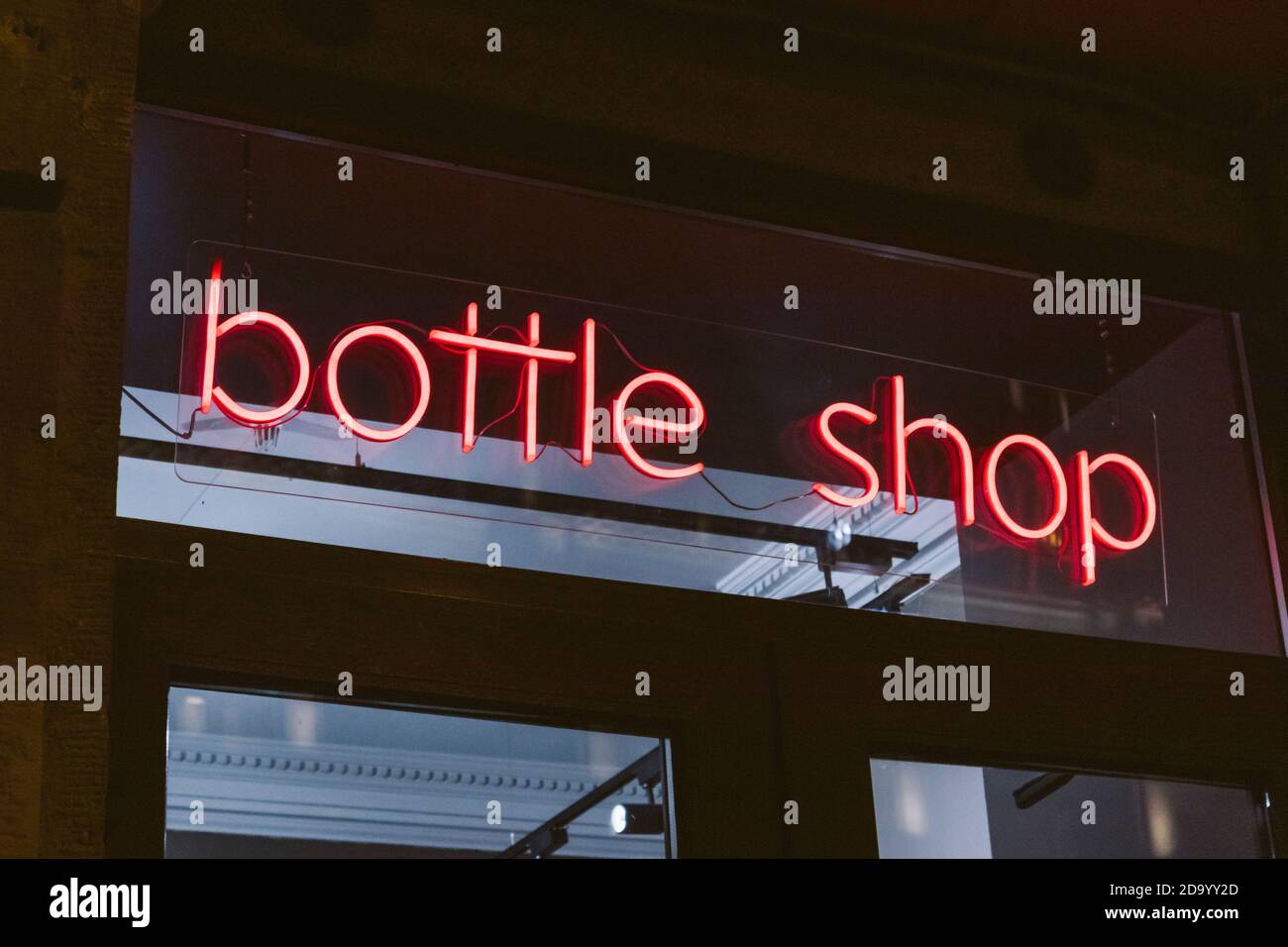 neon sign bottle shop bar wine beer sale showcase Stock Photo - Alamy