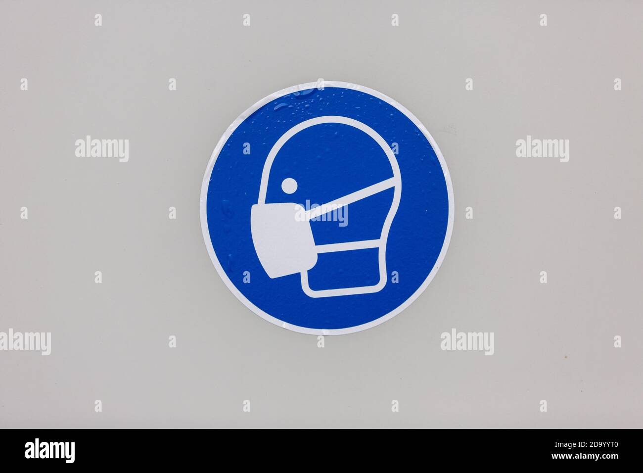 Blue info sign for a mask compulsory Stock Photo - Alamy