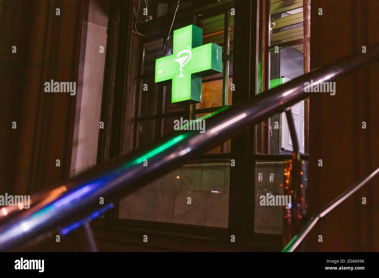 pharmacy cross with snake 24 hours first aid night Stock Photo - Alamy